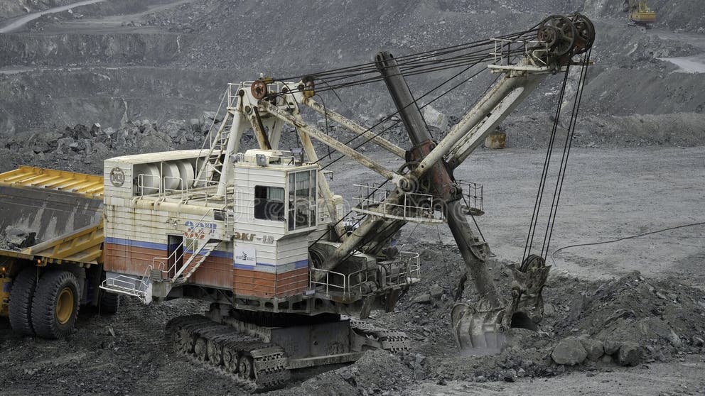 Mining Excavator Scooping Up Ore in a Quarry. Close Up of Limestone ...