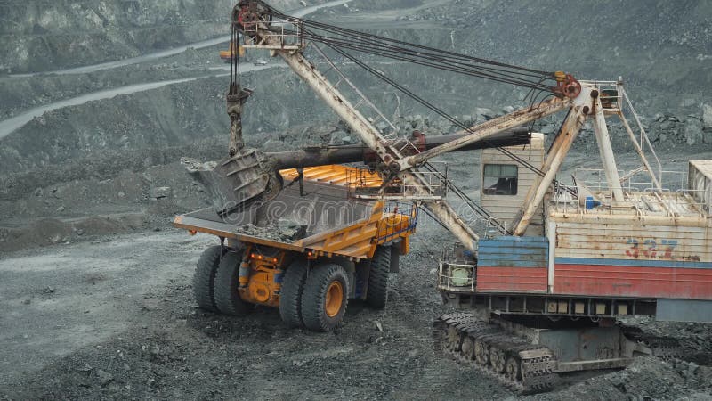Mining Excavator Scooping Up Ore in a Quarry. Close Up of Limestone ...