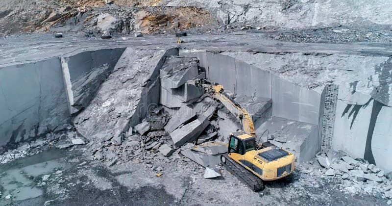 Mining Machinery Extracting Ornamental Rock in a Quarry Working on ...