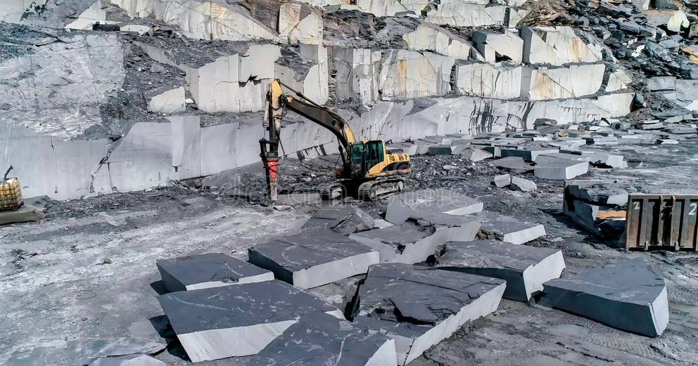 Mining Machinery Extracting Ornamental Rock in a Quarry Working on ...