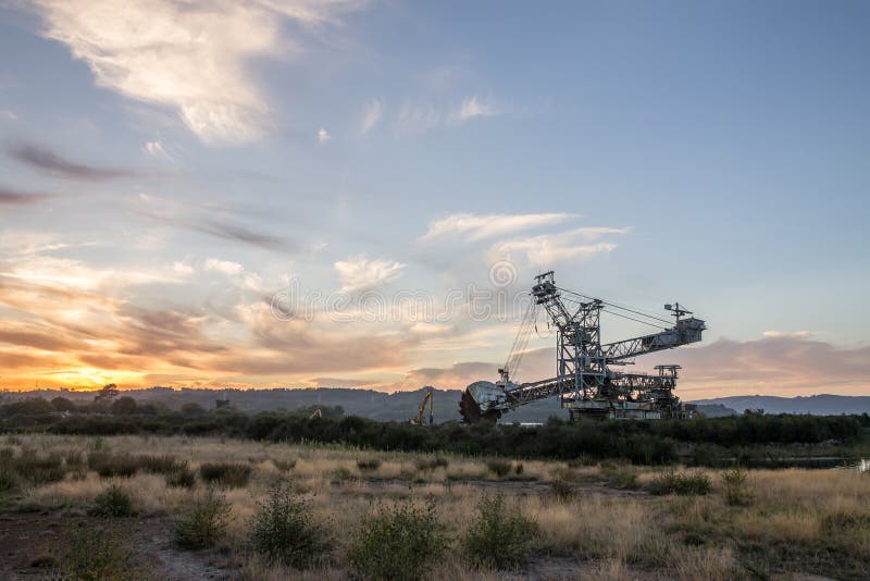 Mining Machinery in a Sunset Stock Photo - Image of iron, digger: 101873500