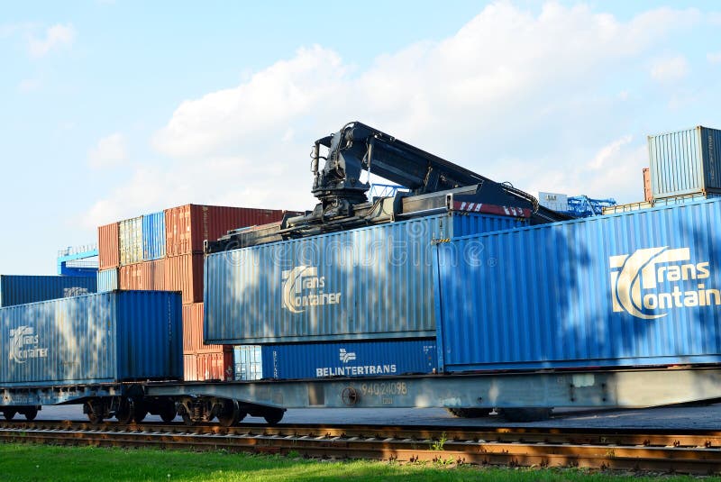 Loading Shipping Containers by Richtracker on the Freight Rail Car at ...