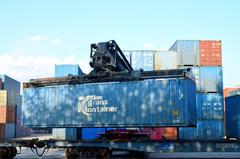 Loading Shipping Containers by Richtracker on the Freight Rail Car at ...