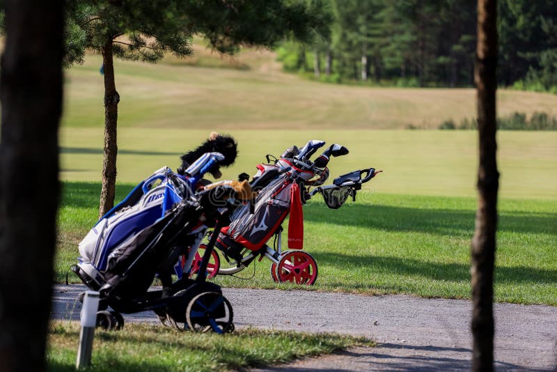 Minsk. Belarus - 24.07.2021 - Push-Pull Golf Carts. Green Grass, Trees ...