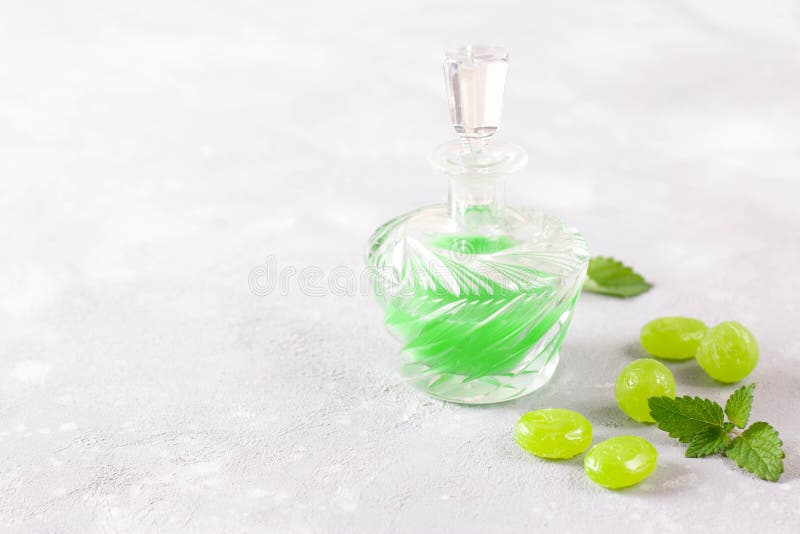 The Mint Extract in a Jar and Mint Candies. Copy Space Stock Image ...