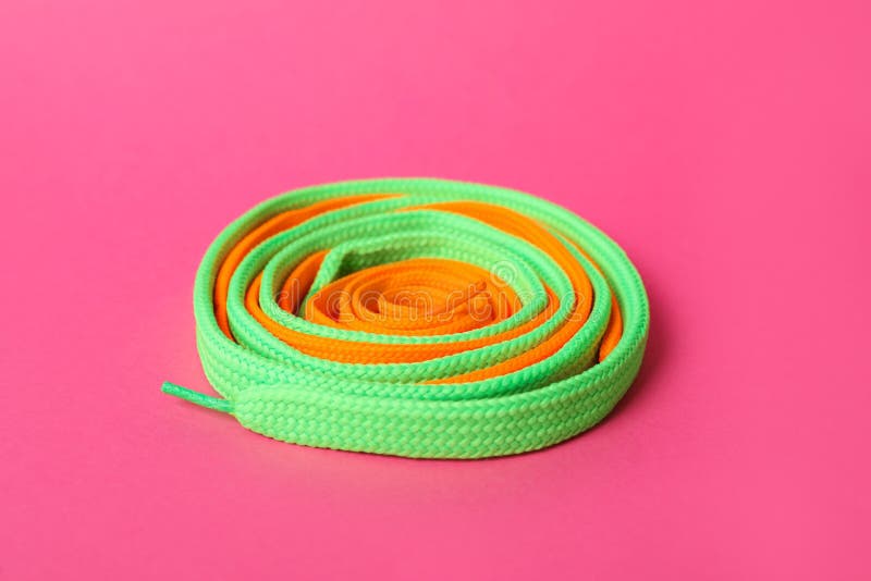 Mint and Orange Shoe Laces on Pink Background Stock Image - Image of ...