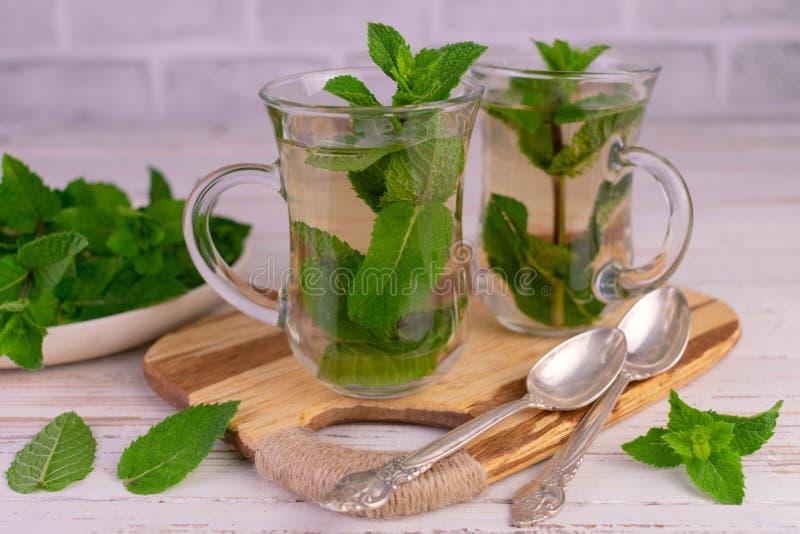 Mint Tea in Transparent Cups on a Wooden Board. Stock Image - Image of ...