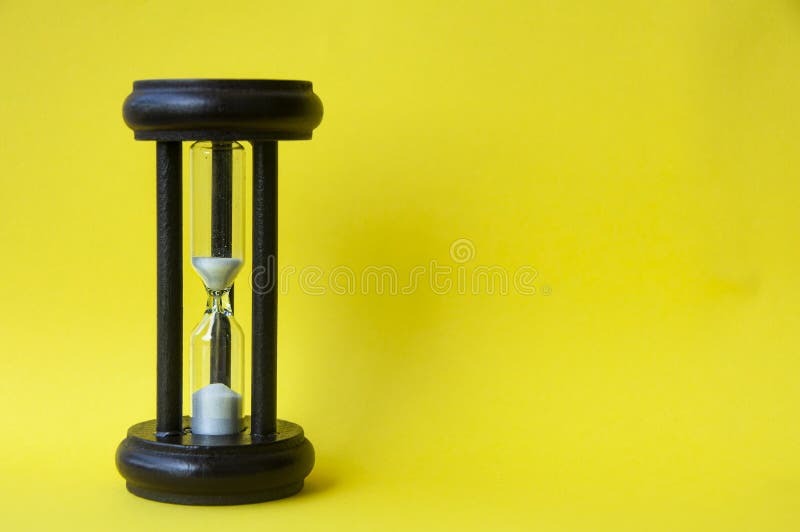 Minute Glass Isolated on Yellow Background. Copy Space Concept Stock ...