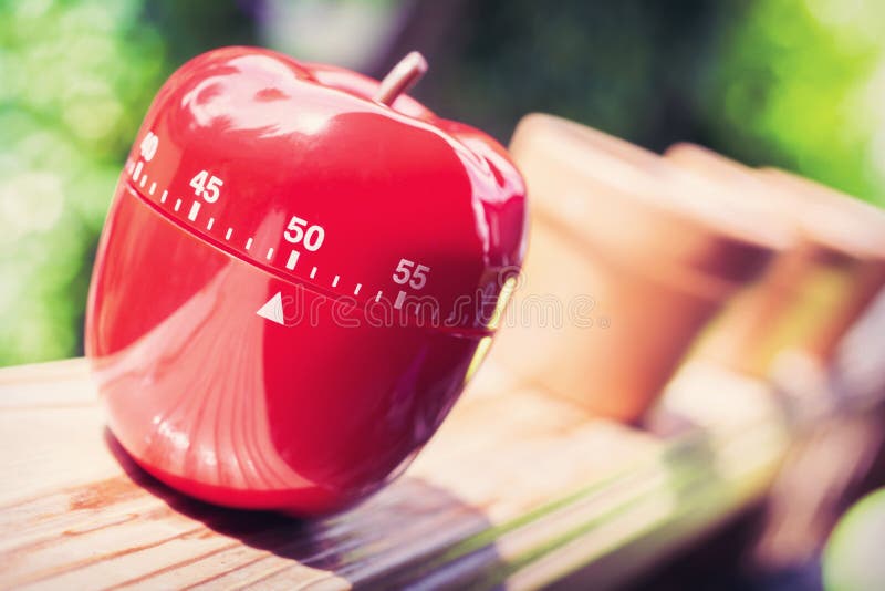 35 Minute Kitchen Egg Timer in Apple Shape Standing on a Handrail Stock ...