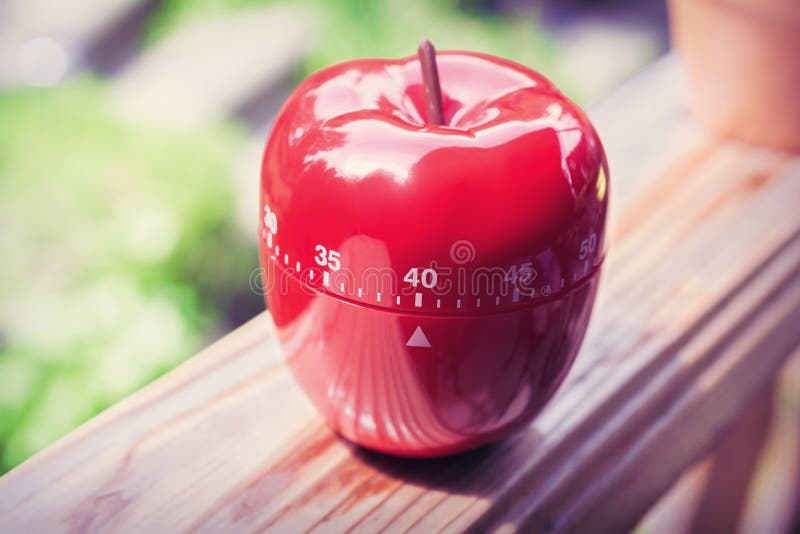 40 Minute Kitchen Egg Timer in Apple Shape Standing on a Handrail Stock ...