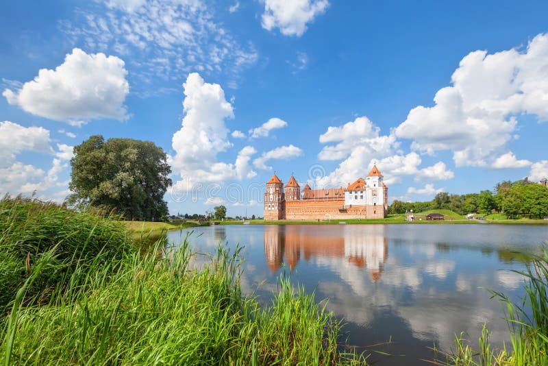 Mir Castle Reflecting in the Water of a Pond, Belarus Stock Photo ...
