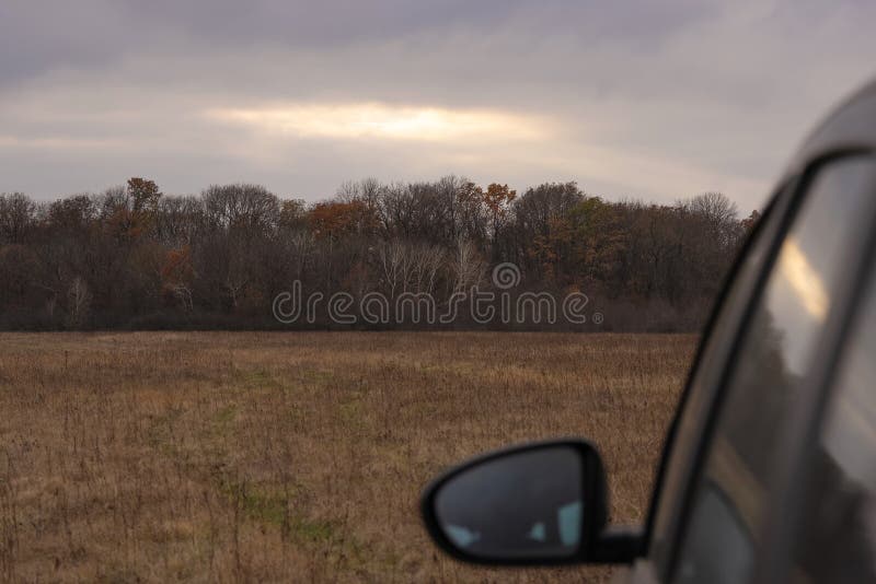Mirror and Car Windows Against the Backdrop of an Autumn Landscape with ...