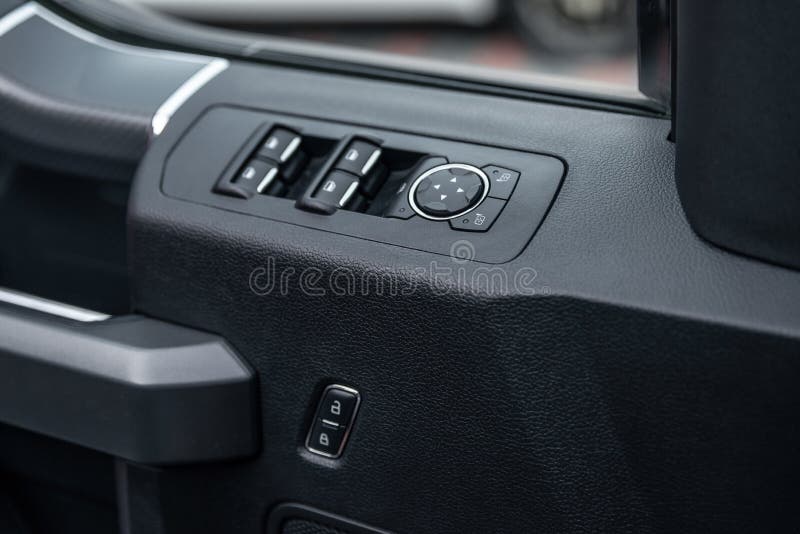 Mirror Control Knob and Window Control Panel in a Modern Car. Automatic ...