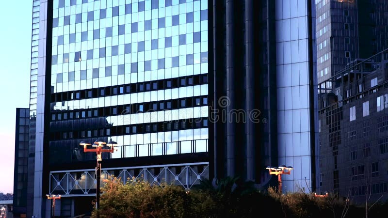 Mirror Facade of a Building with Capsule-shaped External Elevator Stock ...