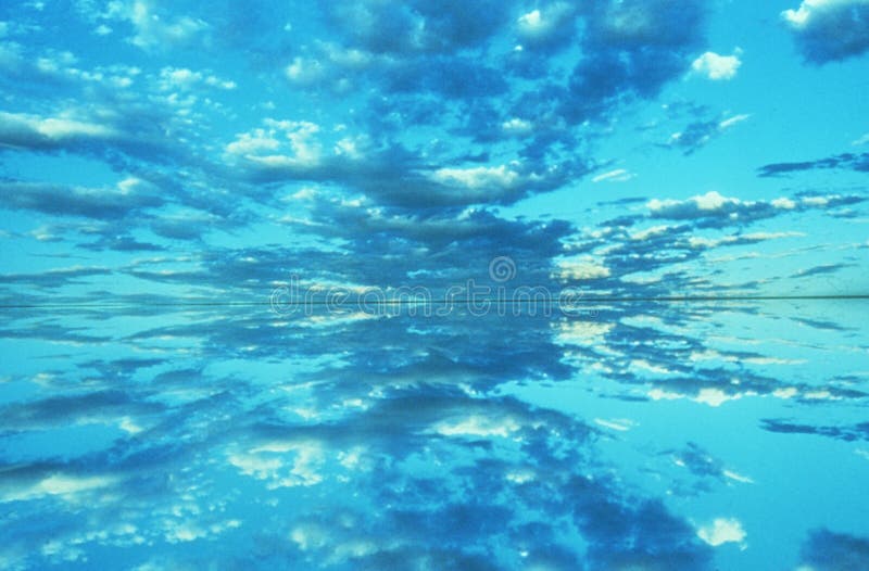 Mirror Image of Clouds and Blue Sky Stock Image - Image of pristine ...