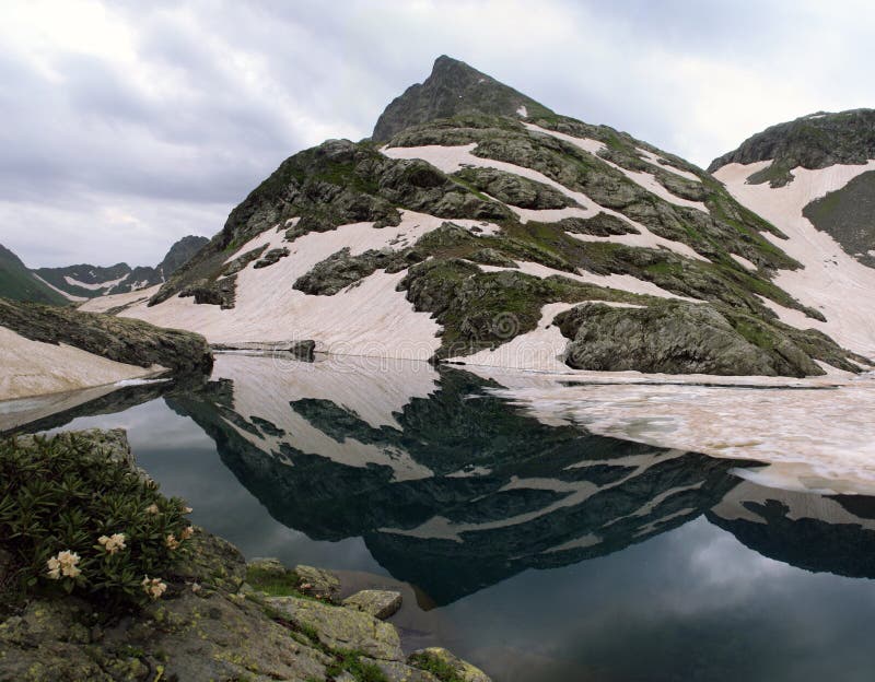 Mirror Image of the Mountain Peaks are Covered with Glaciers in the ...