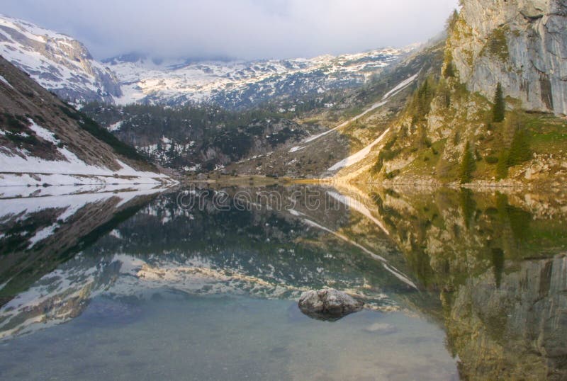 Mirror lake in alps stock photo. Image of blue, hills - 13386872