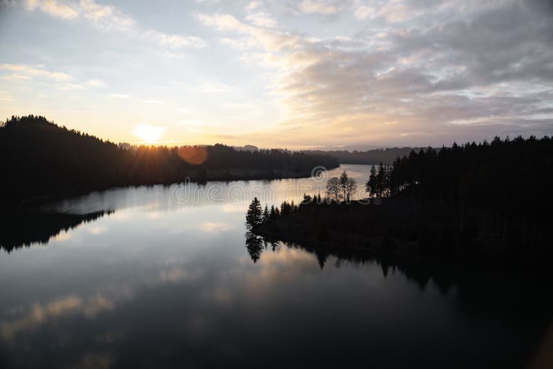 Mirror Lake at Sunset with Forest As Silhouettes Stock Image - Image of ...