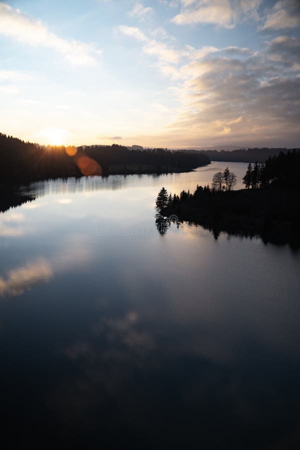 Mirror Lake at Sunset with Forest As Silhouettes Stock Photo - Image of ...