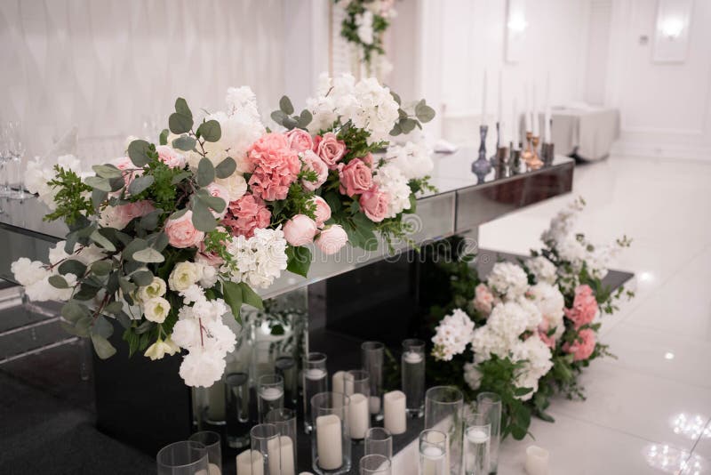 Mirror Main Table at a Wedding Reception with Beautiful Fresh Flowers ...