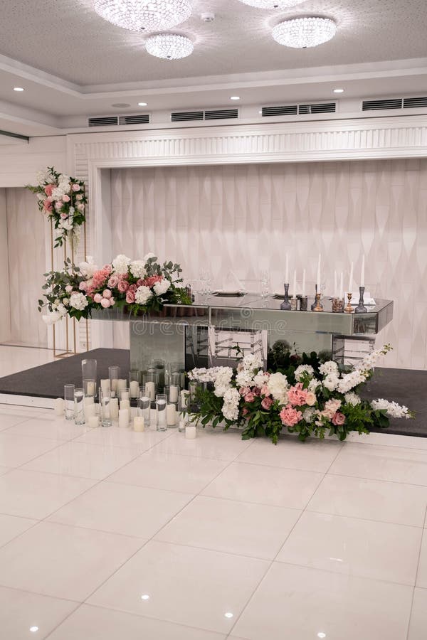 Mirror Main Table at a Wedding Reception with Beautiful Fresh Flowers ...