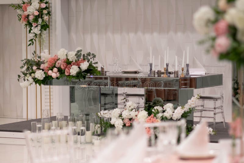 Mirror Main Table at a Wedding Reception with Beautiful Fresh Flowers ...