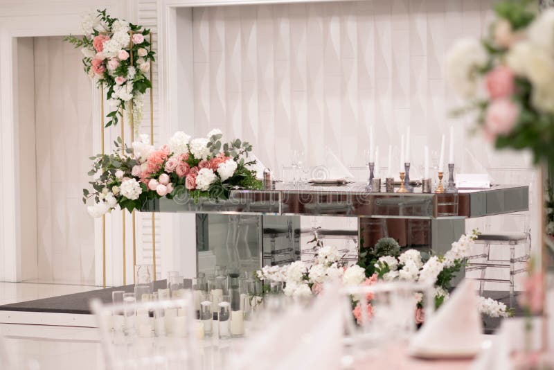 Mirror Main Table at a Wedding Reception with Beautiful Fresh Flowers ...
