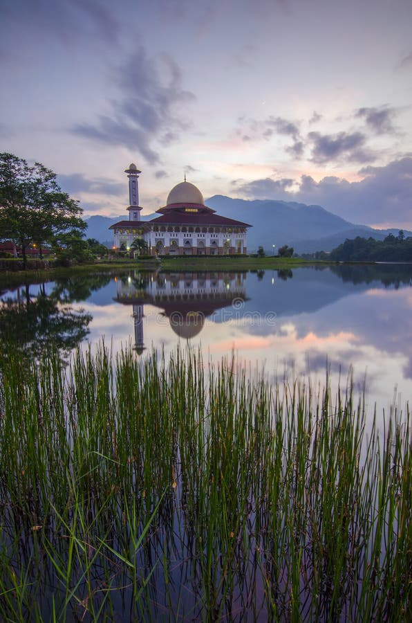 Mirror Reflection of Beautiful Mosque during Sunrise. Stock Photo ...