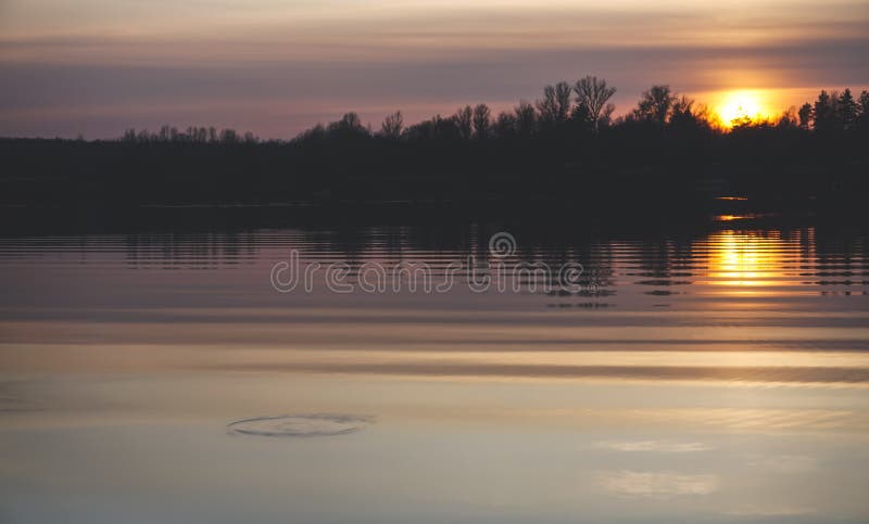 Mirror Reflection of the Sunset in the Water Ripples of the River Stock ...