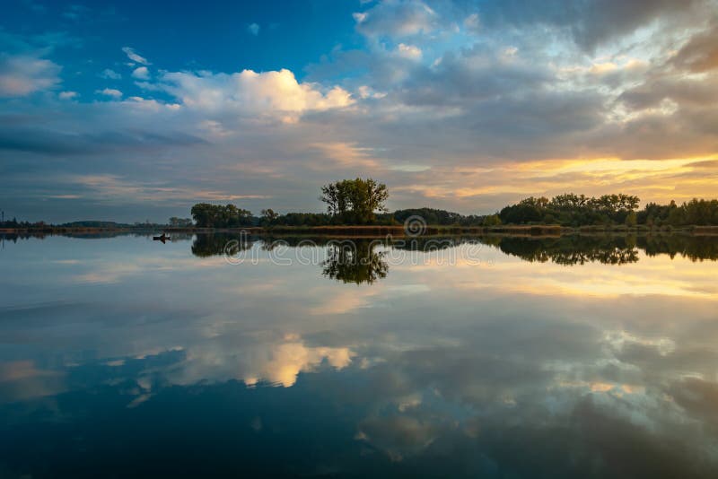 Mirror Reflection in the Water of Evening Clouds Stock Image - Image of ...