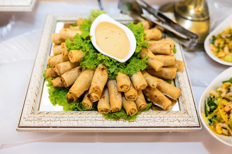 Spring rolls with a sauce stock photo. Image of table - 213573466