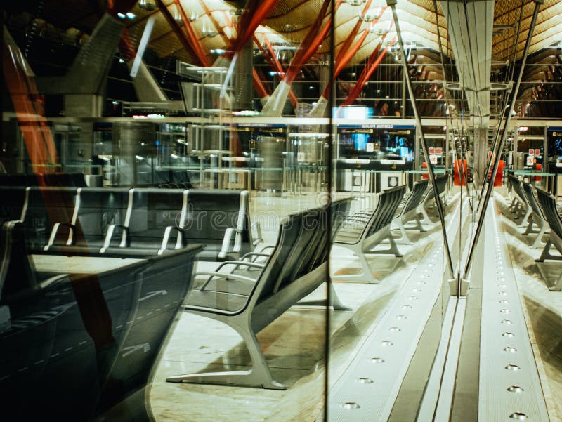 Mirror View of a Bench and Window in the Airport Stock Photo - Image of ...