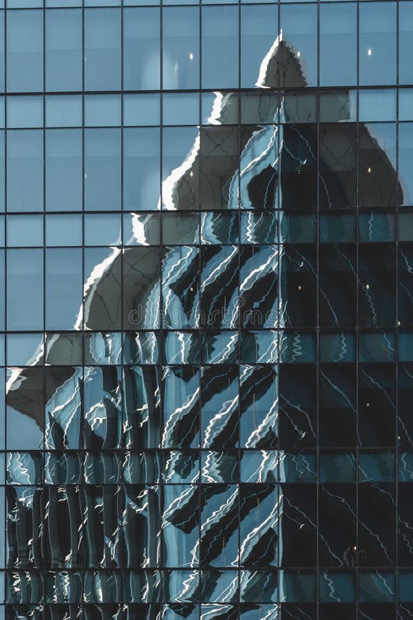 Mirrored Reflection of a Modern Corporate Office Building in the Glass ...