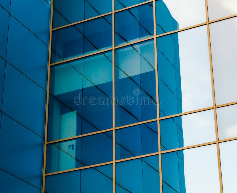 Mirrored Windows of the Facade of an Office Building with Blue P Stock ...