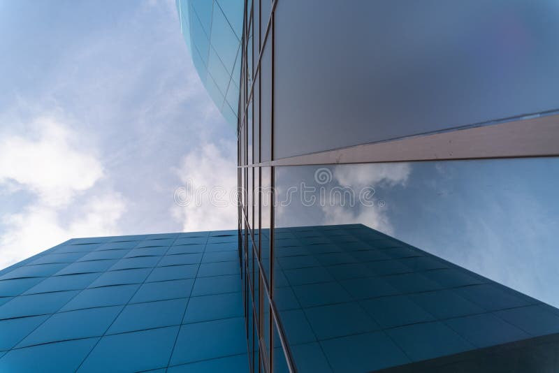 Mirrored Windows of the Facade of an Office Building with Blue Panels ...