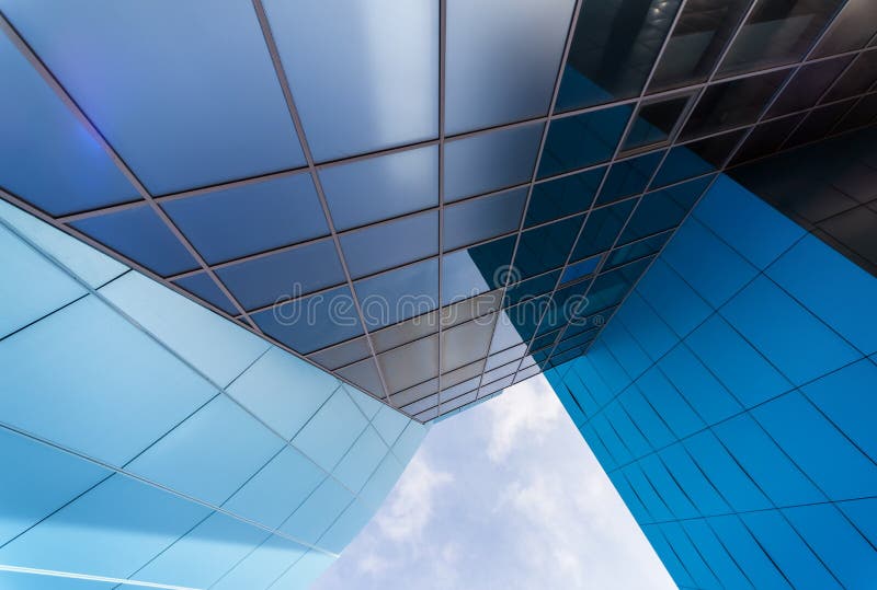 Mirrored Windows of the Facade of an Office Building with Blue Panels ...