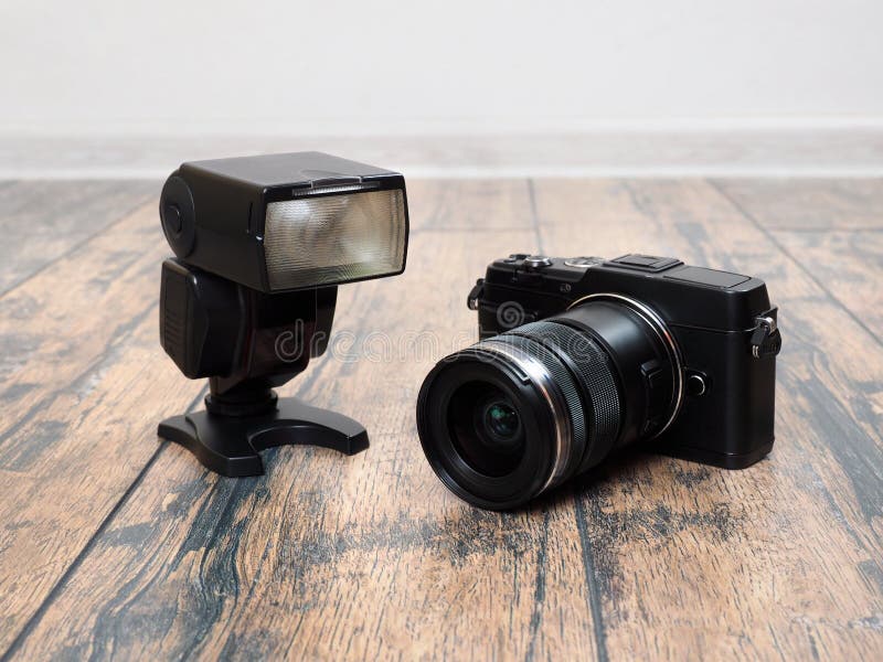 Mirrorless Camera the Camera and Flash on the Floor Stock Photo - Image ...