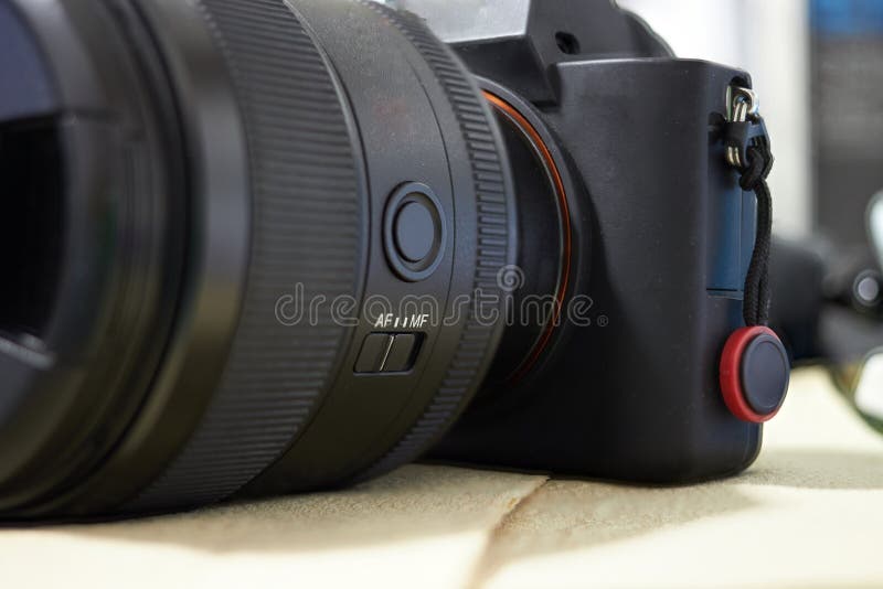 Mirrorless Camera with Lens in Side View on Table Stock Image - Image ...