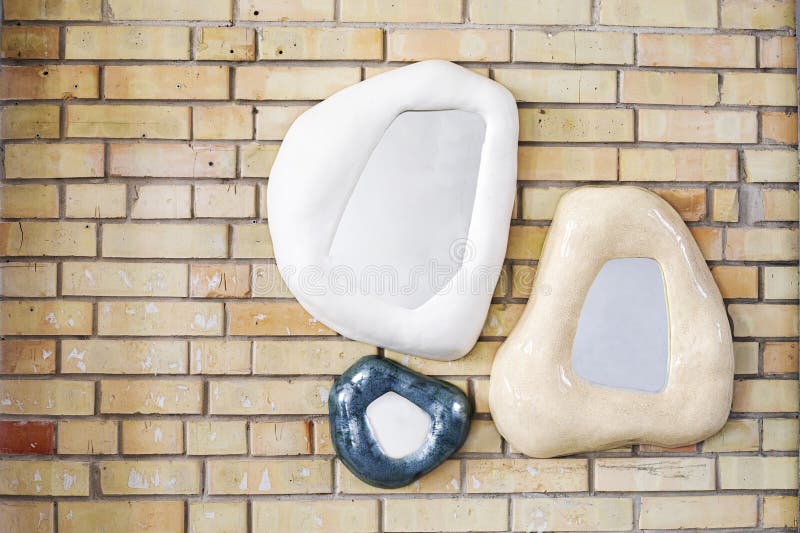 Mirrors of Different Shapes on a Brick Wall Stock Image - Image of ...