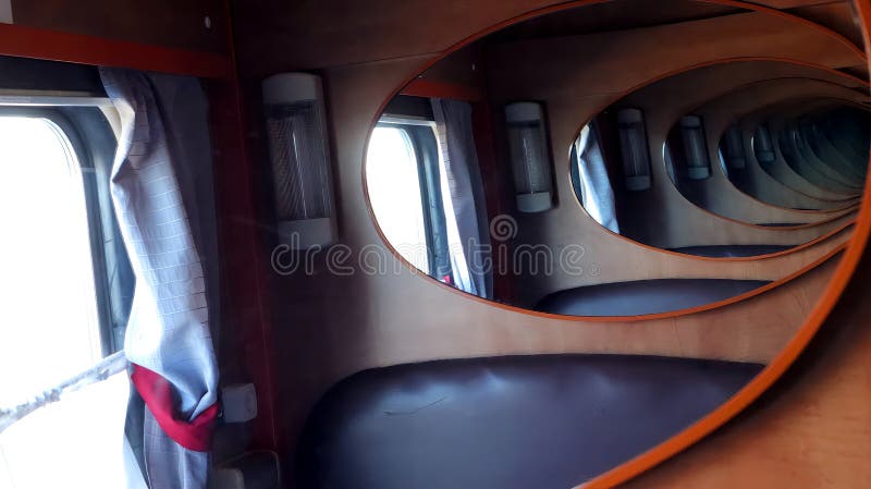 Endless Reflections Create Mesmerizing Optical Illusion in Train Compartment with Mirrors Stock ...