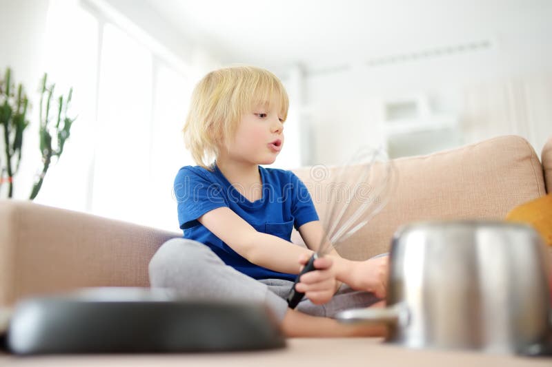 Mischievous Preschooler Boy Play the Music Using Kitchen Tools and ...