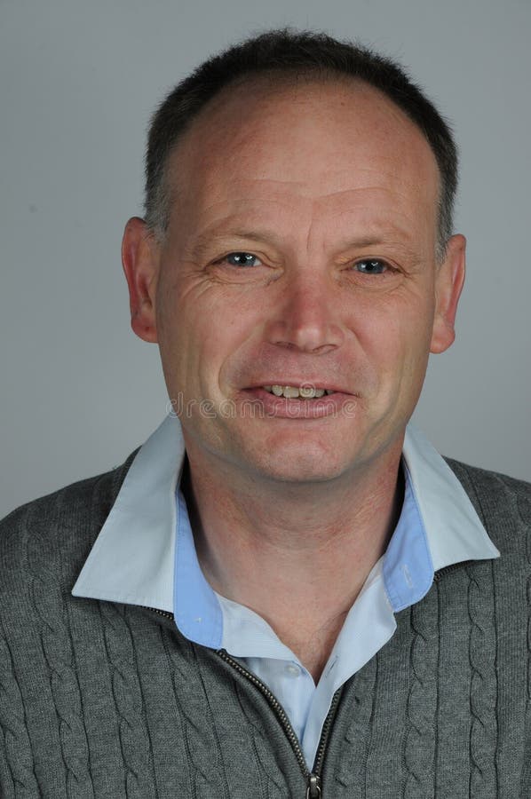 Mischievous Smiling Middle-aged Man Stock Photo - Image of mischievous ...