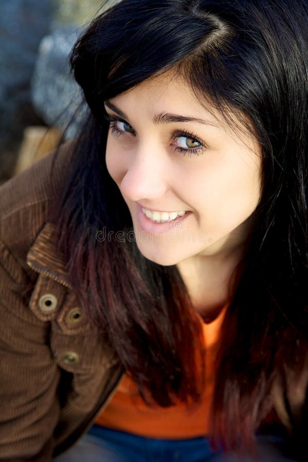 Mischievous Young Woman Smiling Stock Photo - Image of looking, modern ...