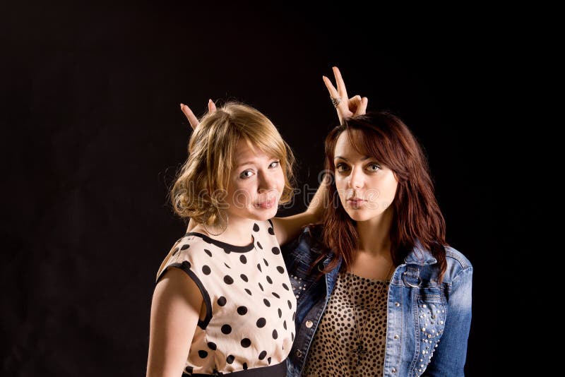 Mischievous young women stock image. Image of expression - 28040121