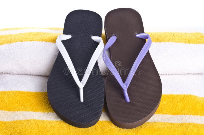 Mismatched Flip Flop on Yellow Striped Beach Towel Stock Image - Image ...