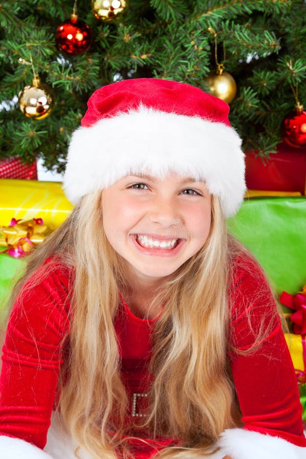 Miss Santa before Christmas Tree and Gifts Stock Image - Image of ...