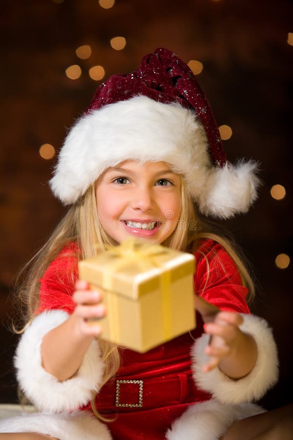 Miss santa with a gift stock photo. Image of holiday - 11583778
