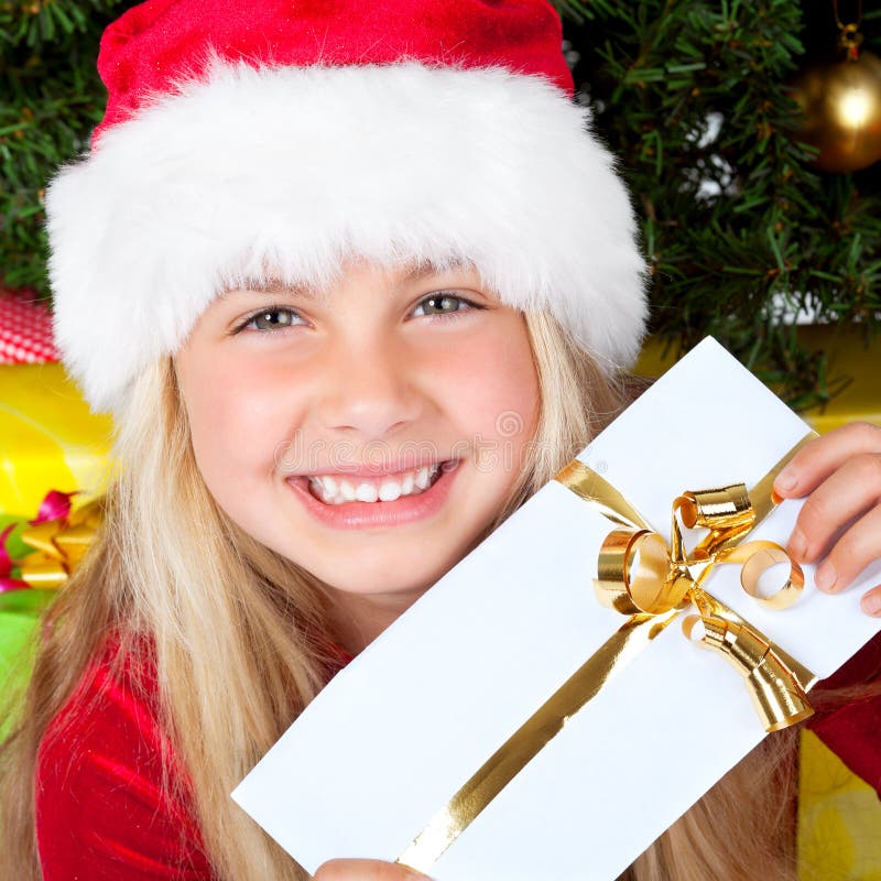 Miss Santa Holding a Gift and Smiling Stock Photo - Image of colorful ...