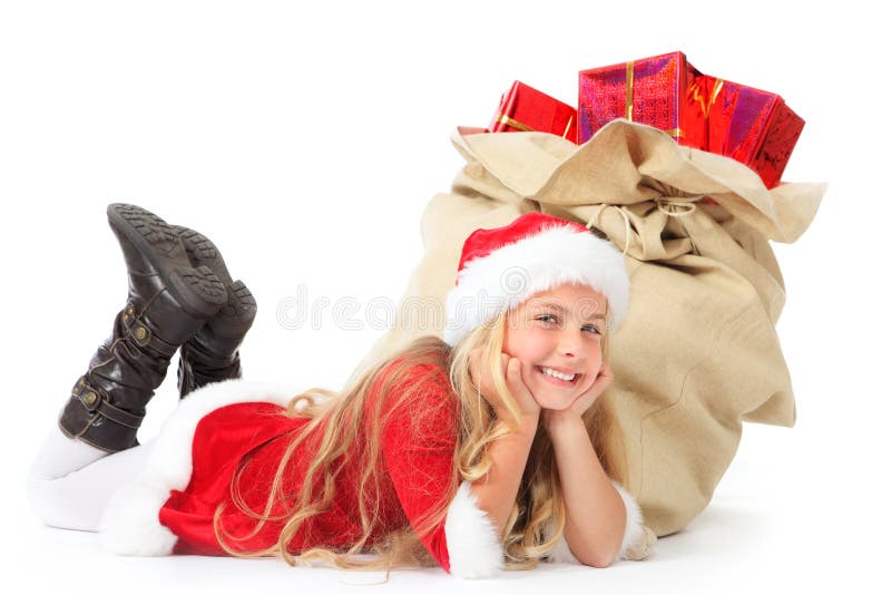 Miss Santa Lying beside Christmas Sack Smiling Stock Image - Image of ...