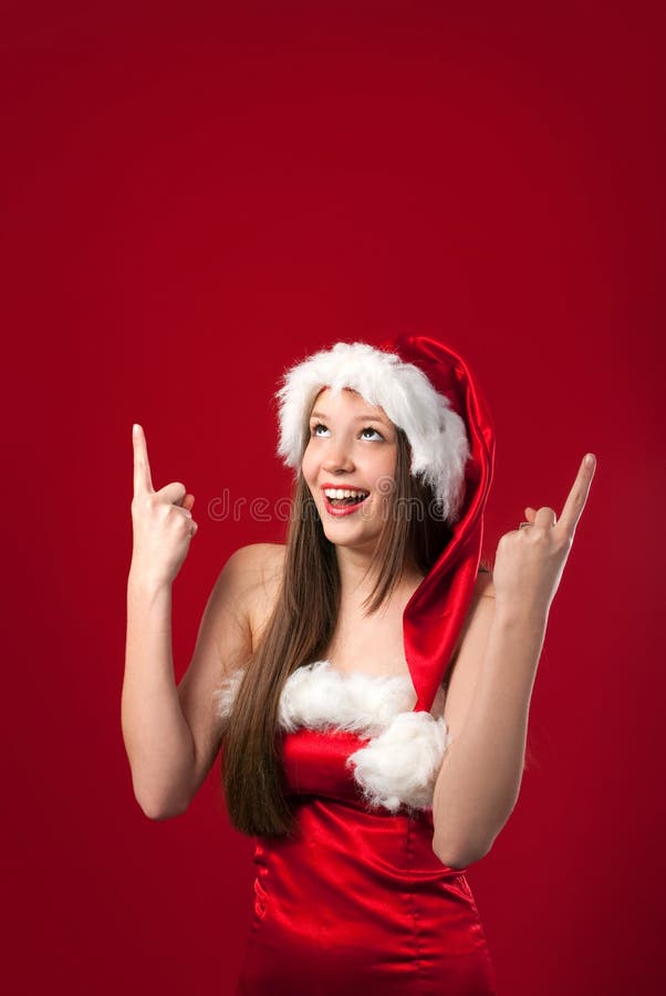 Miss Santa S Showing Something Above Her. Stock Image - Image of female ...